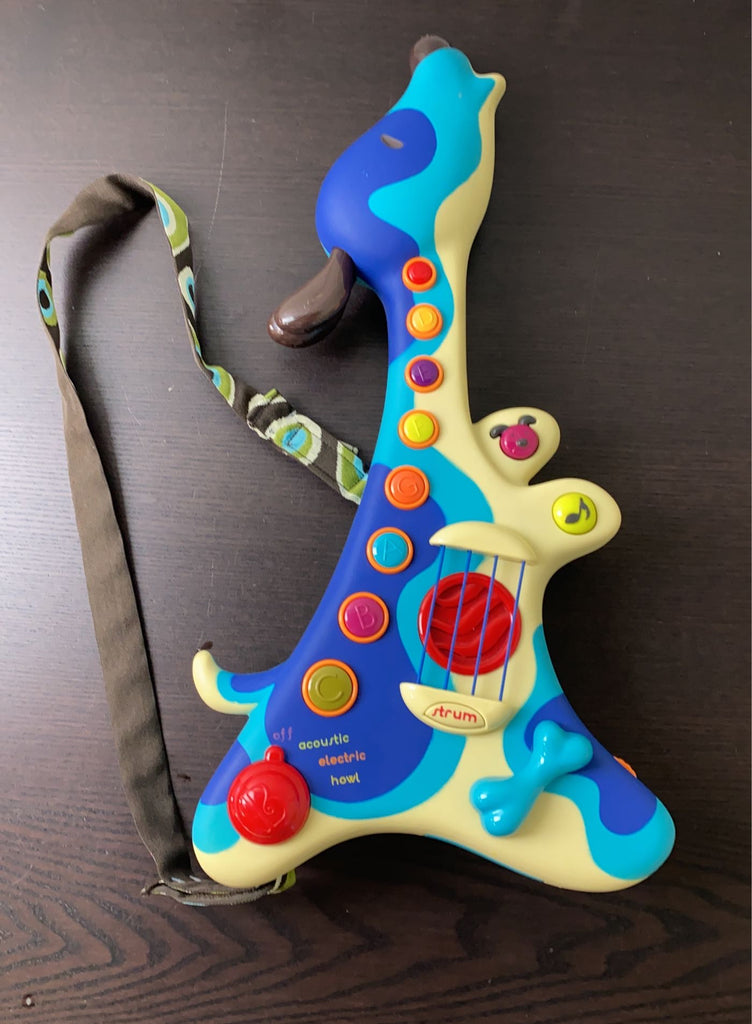 B. Toys B. Woofer Guitar