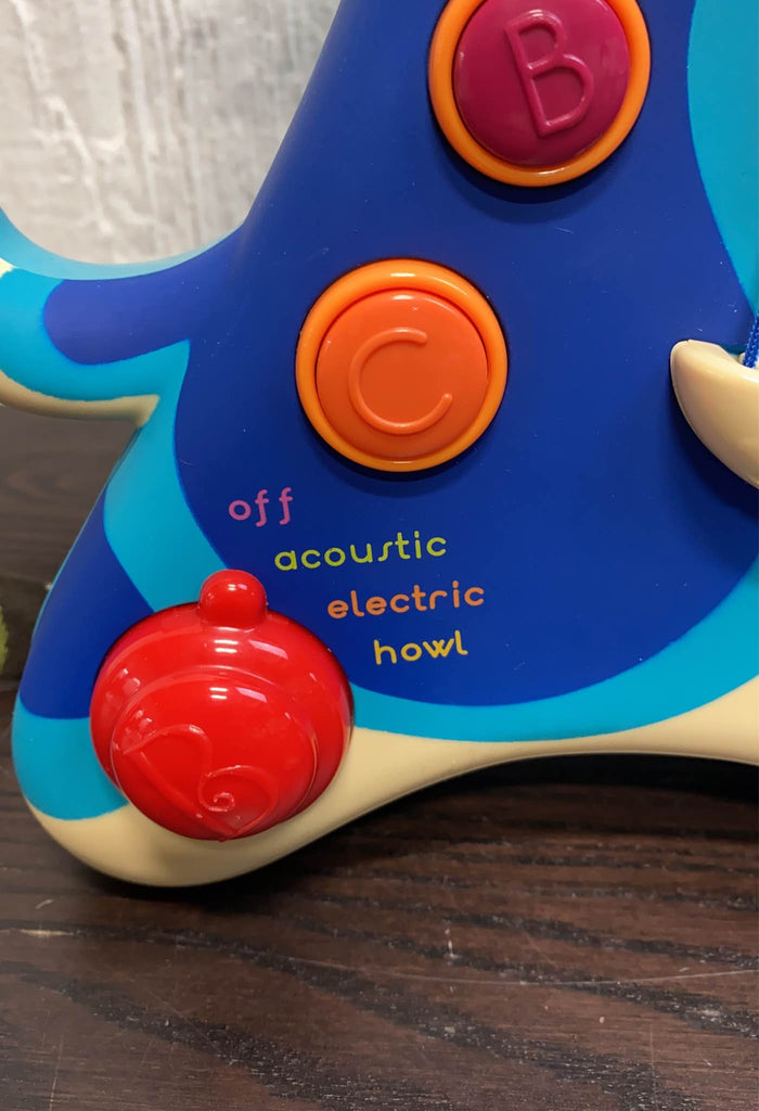 B. Toys B. Woofer Guitar