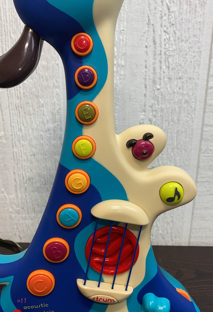 B. Toys B. Woofer Guitar